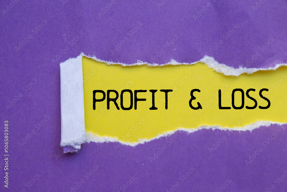 Profit and loss message written on ripped torn purple paper with yellow ...