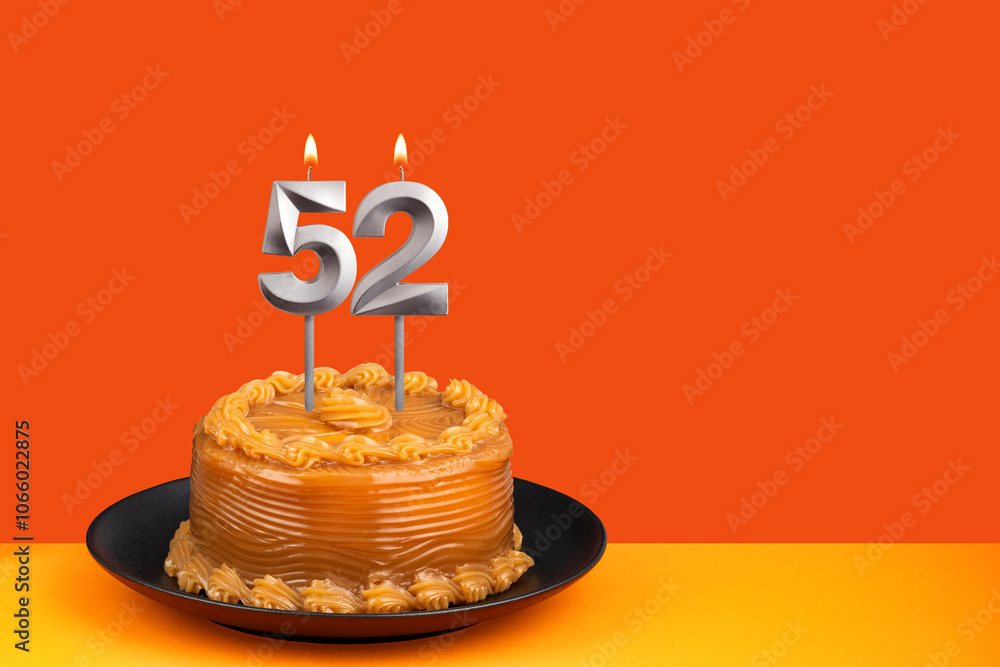 Birthday candle number 52 - Cake with dulce de leche frosting. Stock ...