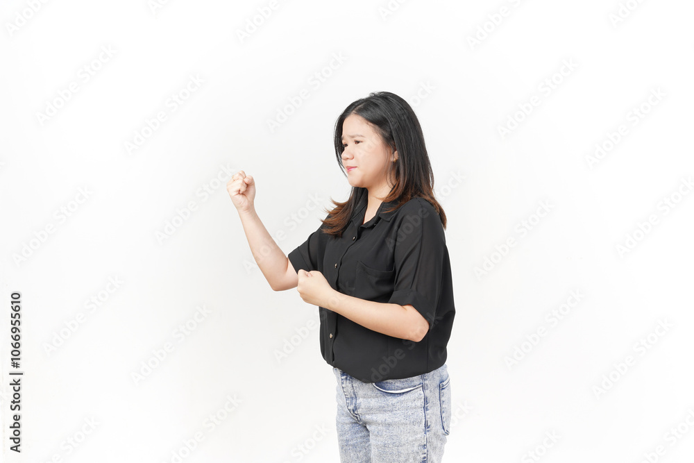 beautiful Asian woman strikes a challenging pose with a clenched fist ...