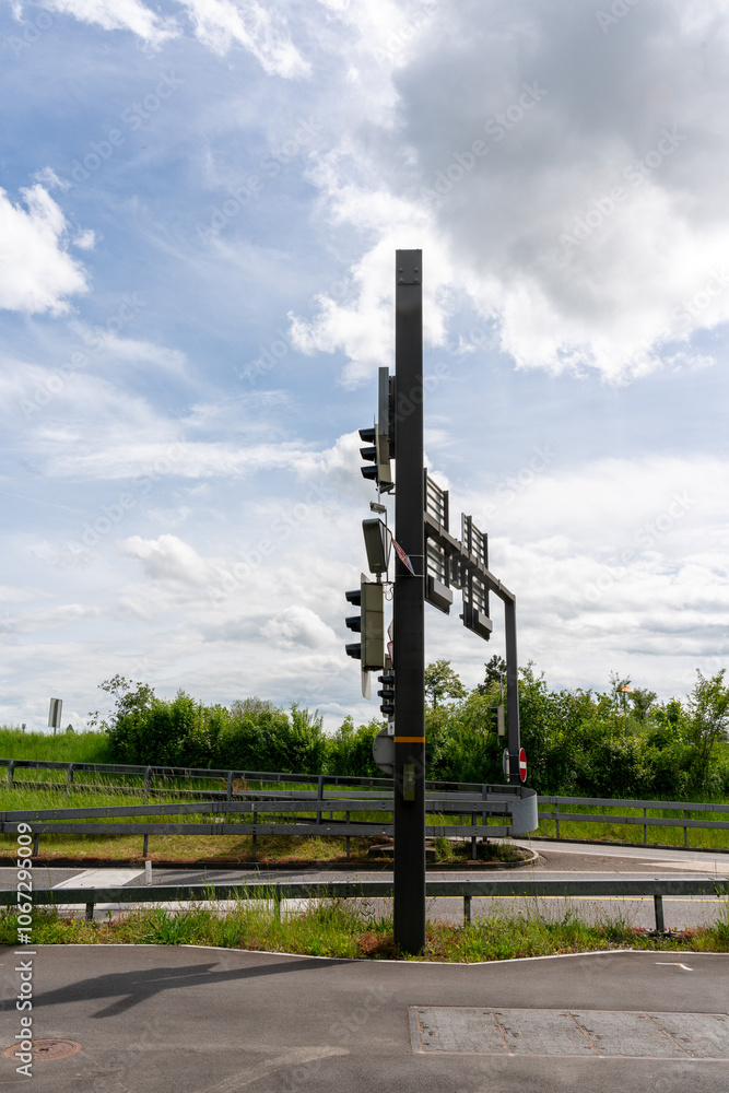 Sign gantry and mast with traffic light and signs on the junction of ...