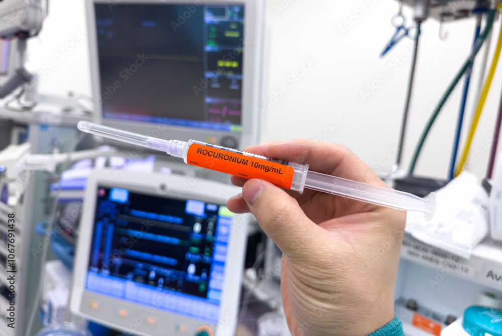 syringes filled with various medications, neatly lined on a sterile ...