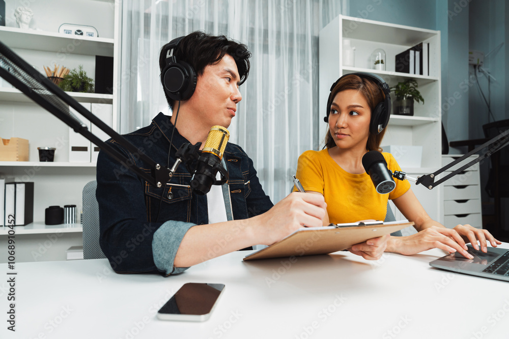 Smiling radio influencer hosts wearing headphones with channel social ...