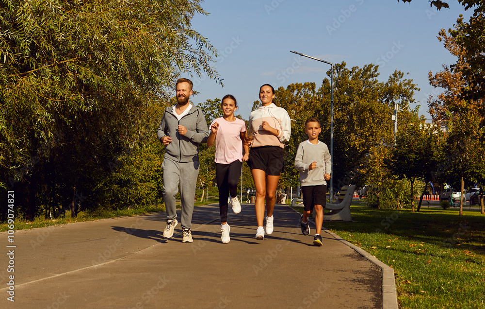 Sporty happy family with children wearing sportswear running together ...