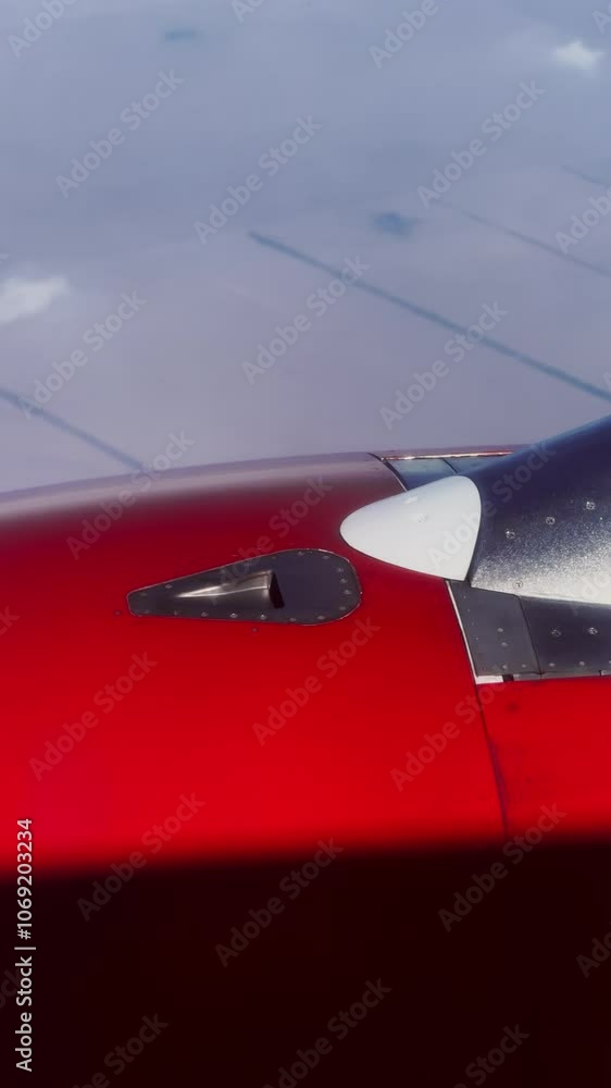 Close up of air intake of turbo engine of airplane flying above ground ...
