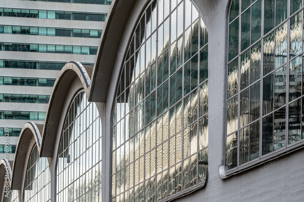 The image replicates arched window design, reflecting modern urban ...