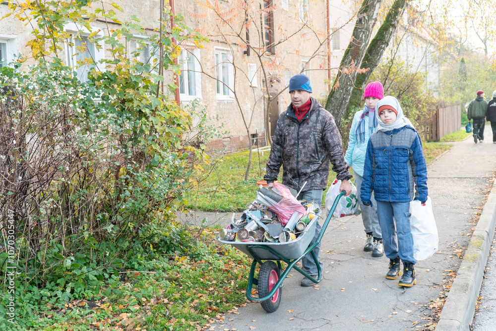 children carry a wheelbarrow with metal, poor children earn money ...