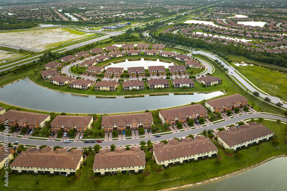View from above of densely built residential houses near retention ...