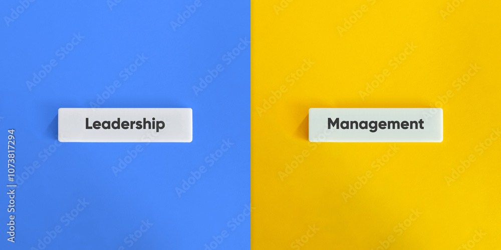 Leadership vs. Management. Text on Block Letter Tiles on Yellow and ...