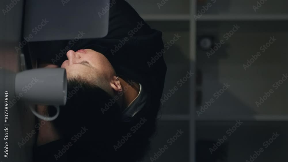 Vertical video. Work fatigue. Night shift. Exhausted workaholic ...