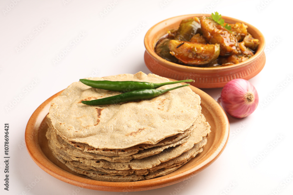 Jowar Roti or Jowar Bhakri with brinjal curry , a staple food in the ...