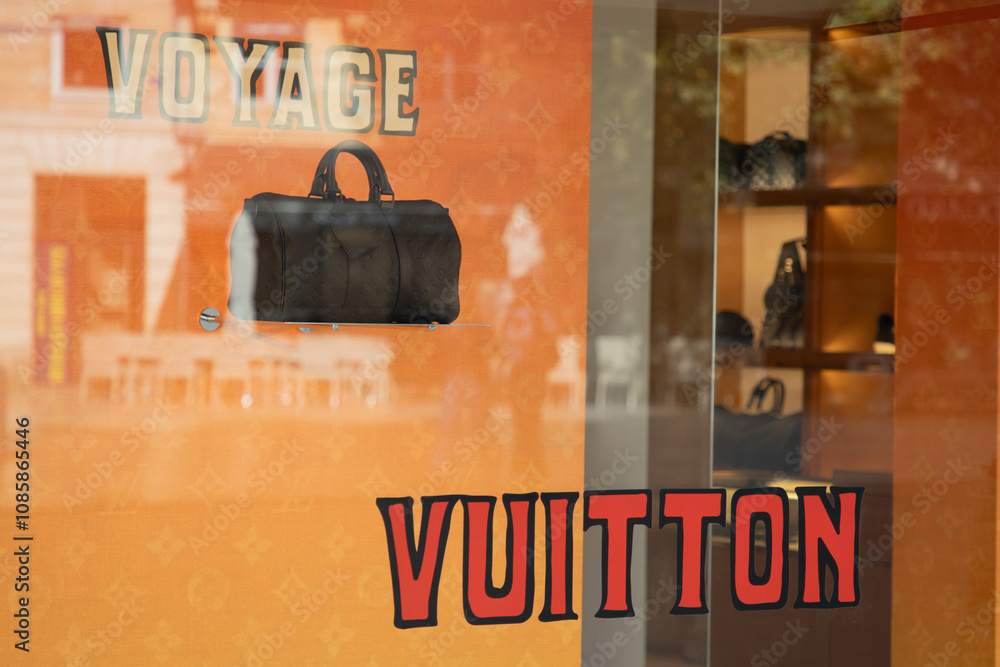 louis vuitton voyage brand text shop and sign logo on facade store ...