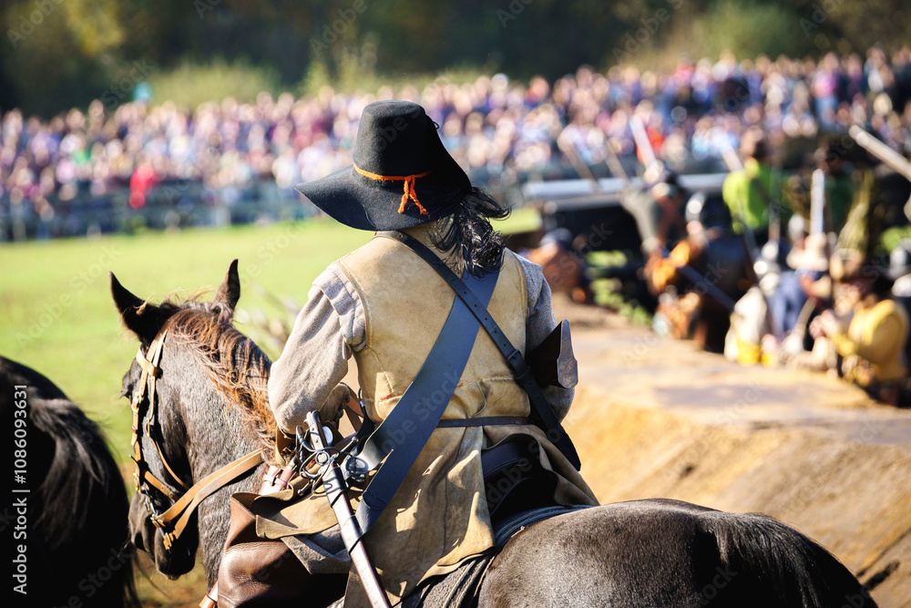 Historical medieval dragoon on horseback riding on the battlefield. An ...