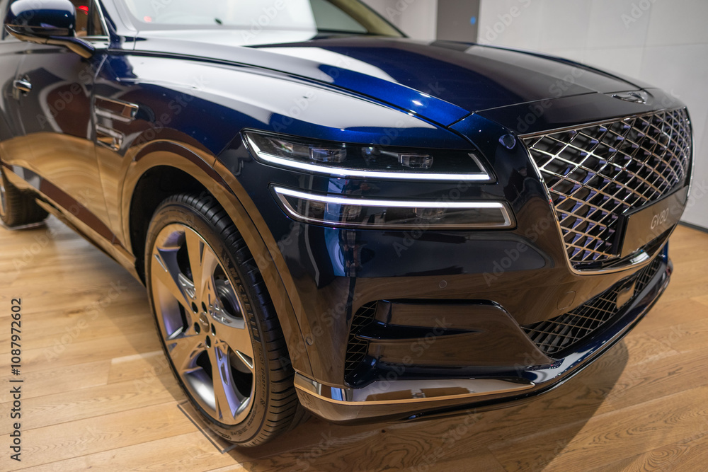 blue Genesis GV80 in stylish dealership, aerodynamic design, powerful ...