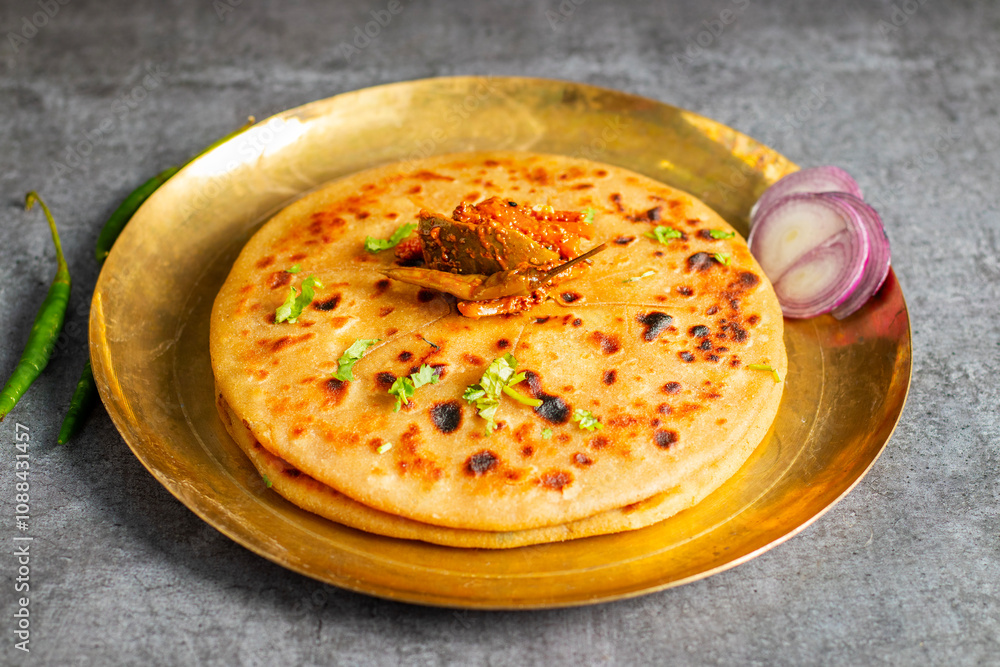 Aloo paratha, a golden-brown Indian flatbread stuffed with spiced ...