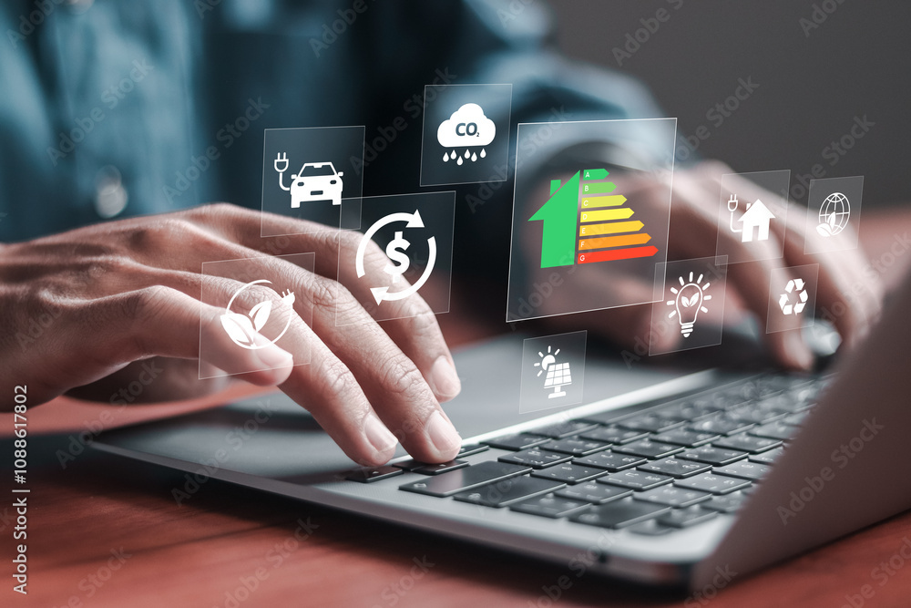 Energy efficiency concept. Businessman use laptop with energy ...