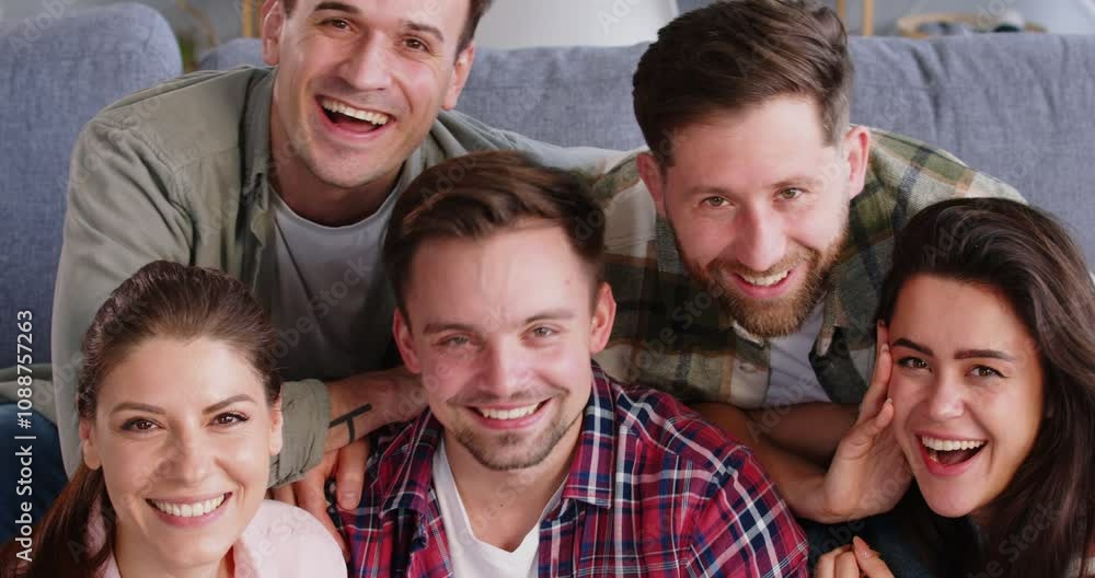 Close up portrait of a diverse friends at home. They are smiling ...