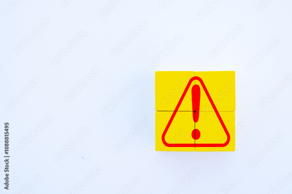Red Attention sing on yellow wooden cube Highlighting Attention Sign ...