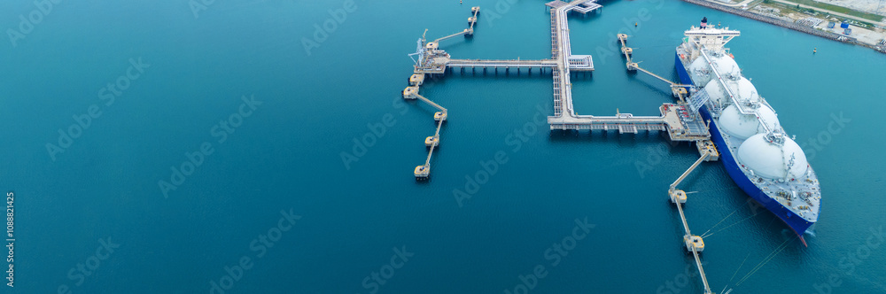 LNG (Liquified Natural Gas) tanker anchored in Gas terminal gas tanks ...