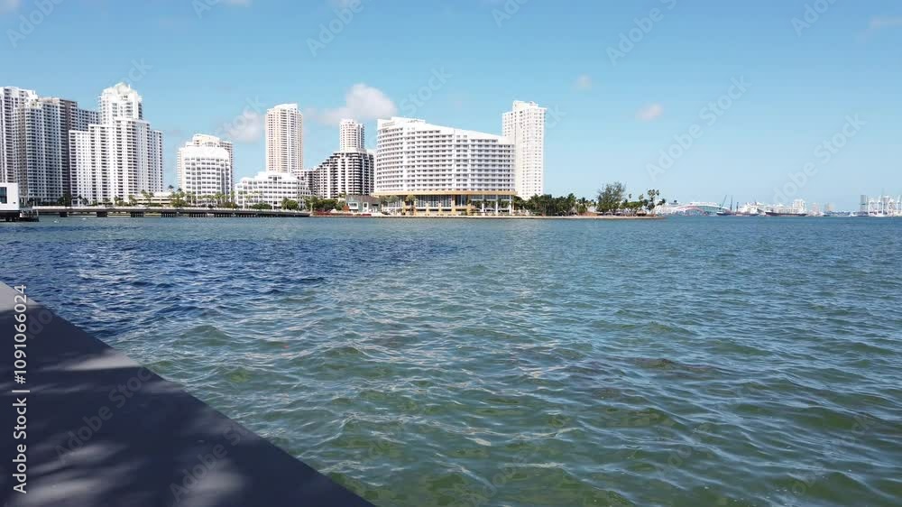 Miami downtown skyline and futuristic mover train above Miami river ...