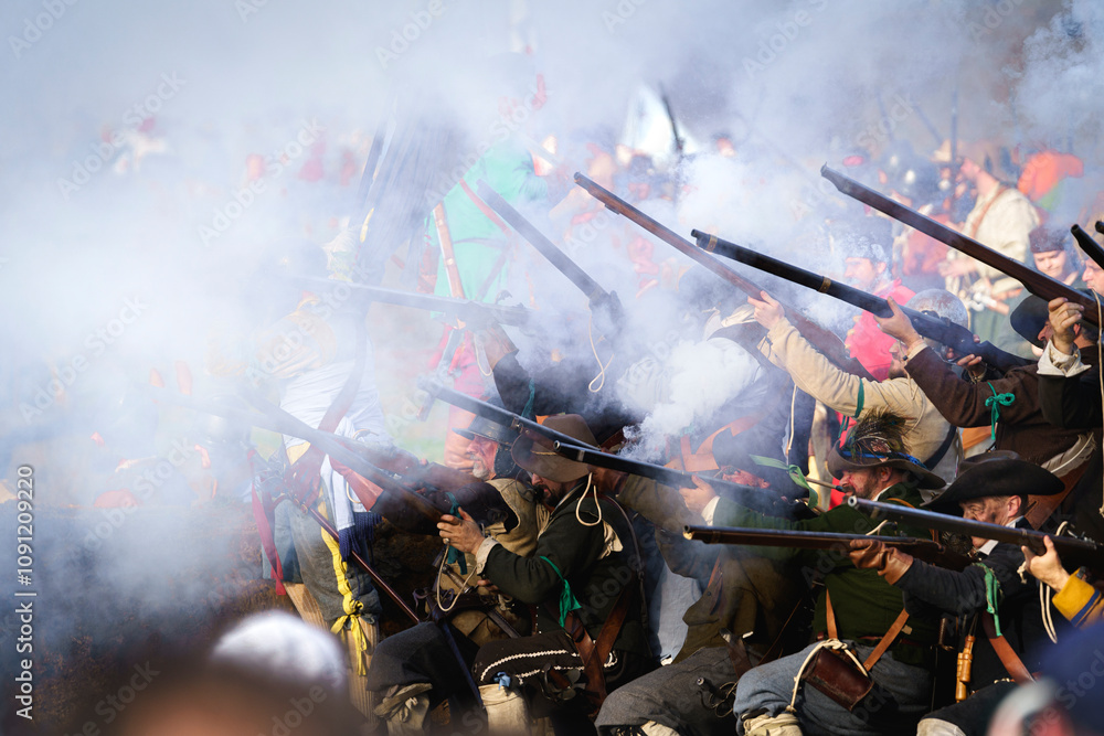 Smoking guns and muskets with a lot of black powder smoke, fired by a ...