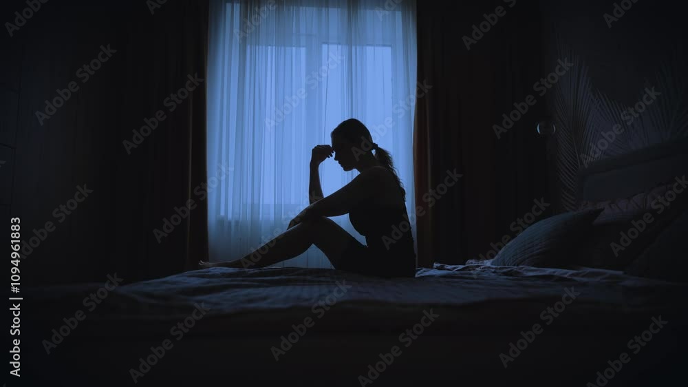 black silhouette upset unhappy woman sitting on bed dark room, mood ...