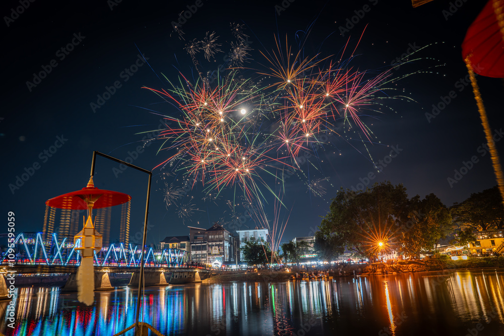fireworks show at iron bridge across ping river where decorate with a ...