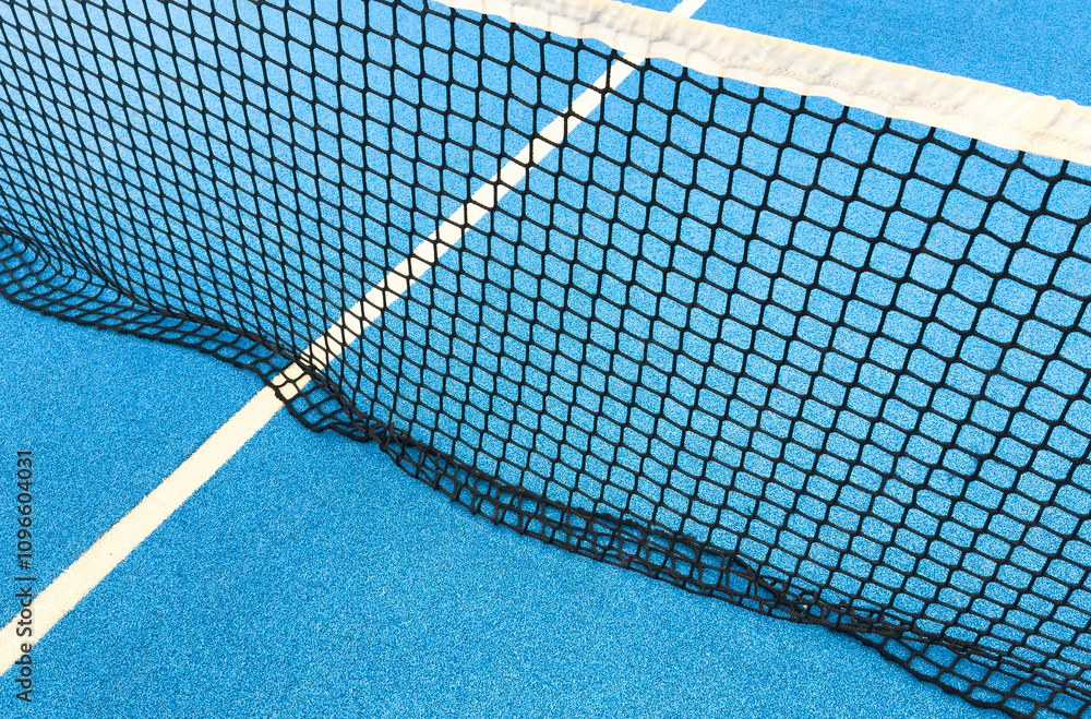 paddle tennis ball next to the net of a paddle tennis court. Stock ...