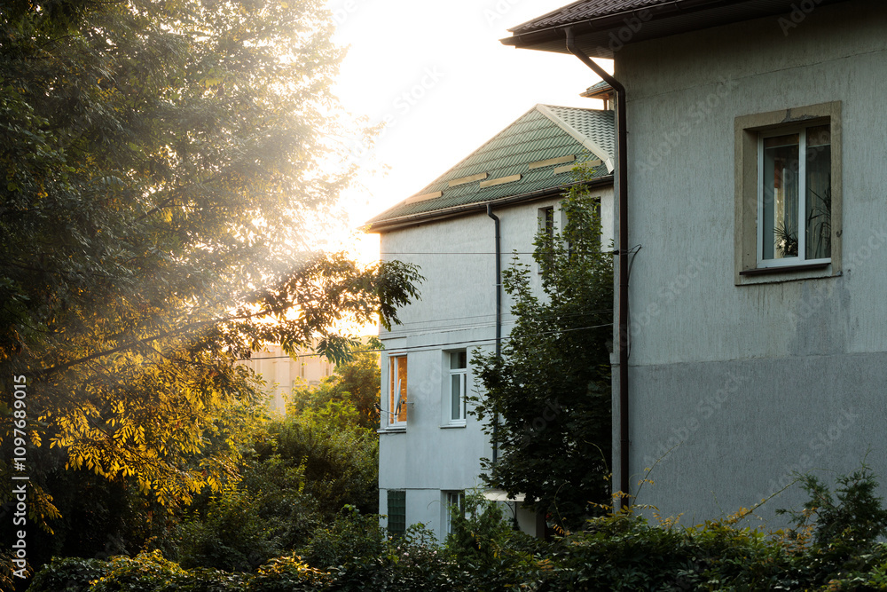 town ordinary living district concrete panel cottages street with trees ...