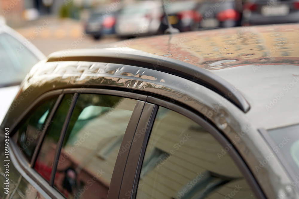 Vehicle exterior damaged by hail with visible dents and scratches on ...