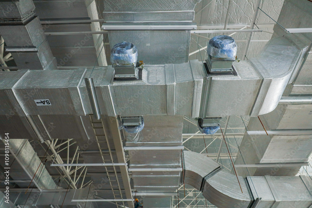 Air conditioning and ventilation system work, duct pipes covered with ...