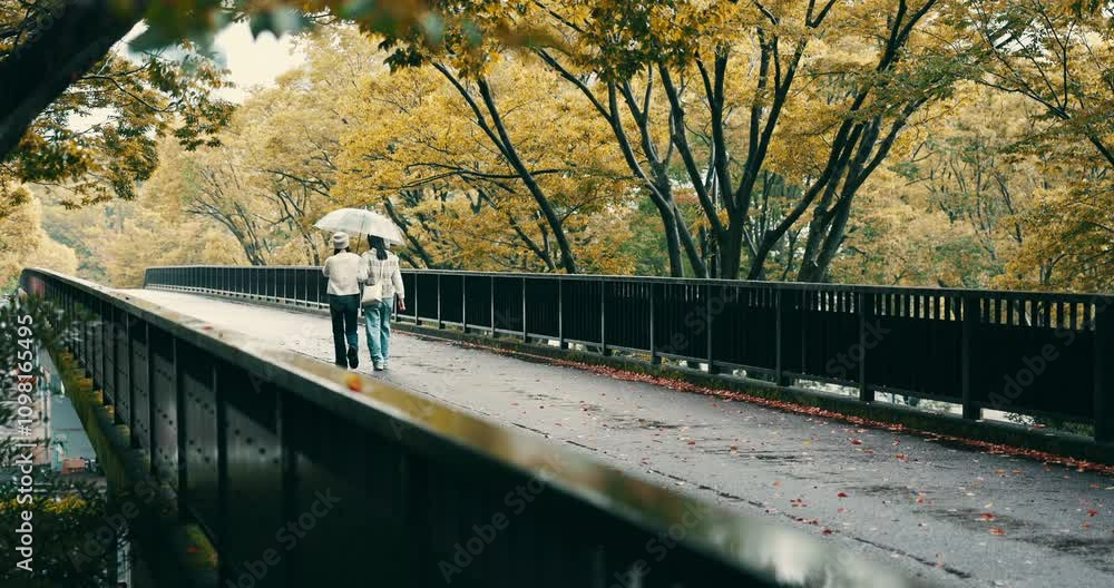 Walking, raining and friends with umbrella, city and bonding of people ...
