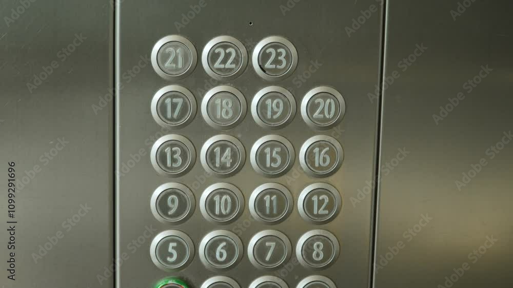 Close up view of elevator panel with buttons numbered from 1 to 23 on ...