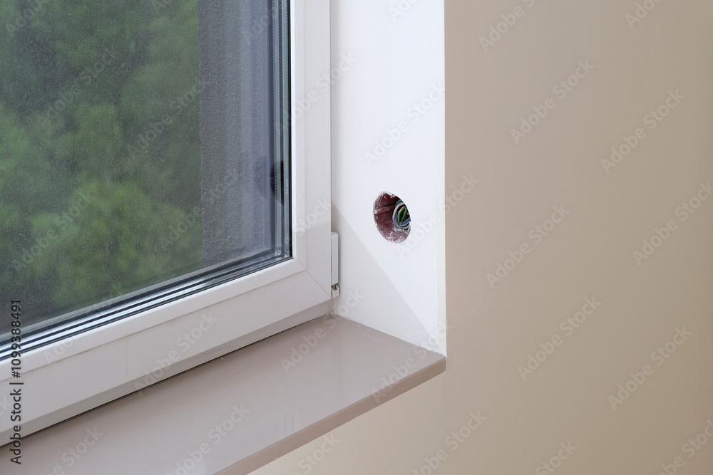 Repair work. Installation of electrical wiring and sockets in window ...