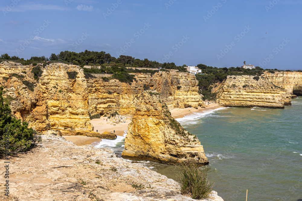 Praia da Marinha Beach among rock islets and cliffs seen from Seven ...