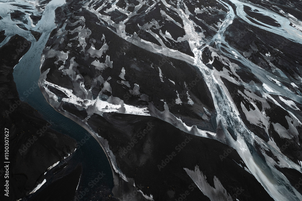 Aerial view of a majestic and serene winter landscape featuring a ...