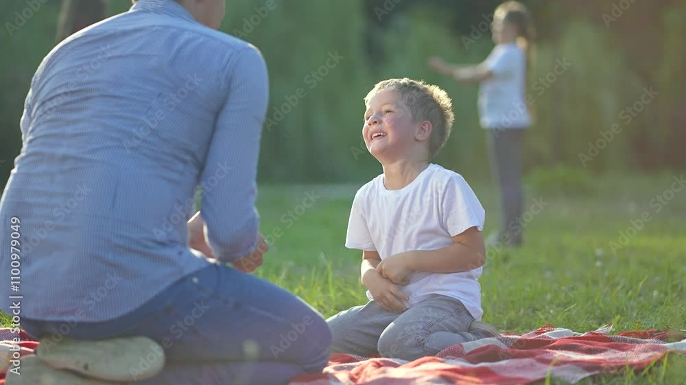 Father playing with children park. Happy family bonding outdoors ...