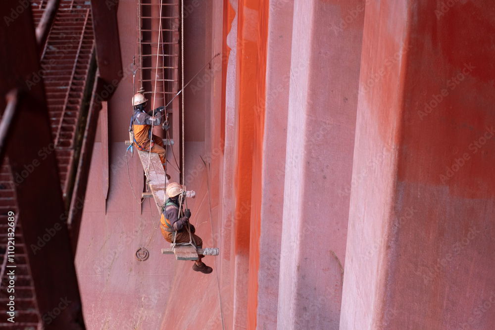 painting of cargo hold using fallen chair hanging from hold inspection ...