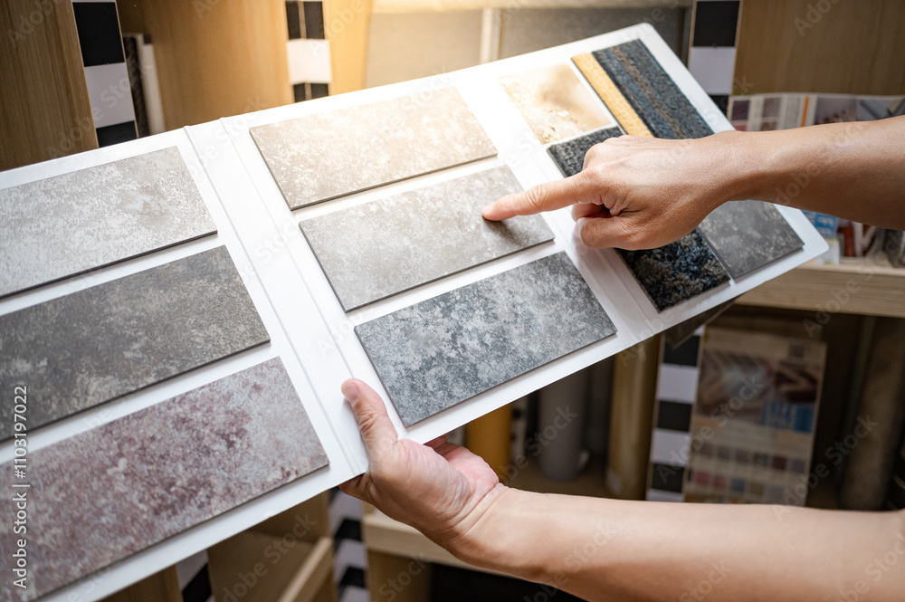 Flooring material design collection. Designer hand pointing at stone ...