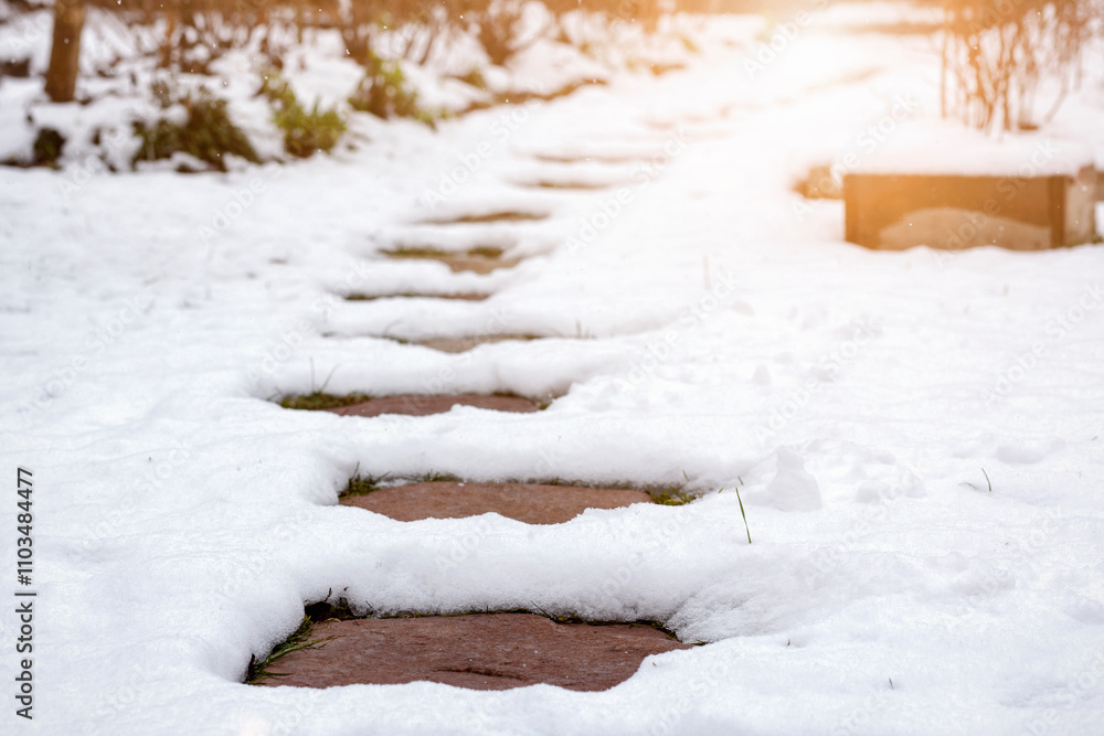 Snow Melting in Garden Path Paving Stones. Winter is Coming. Half ...