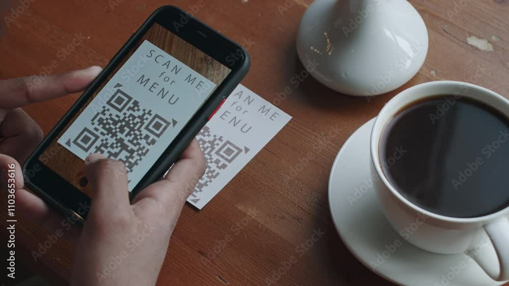 Close-up shot of unrecognizable man scanning QR-code for menu with his ...