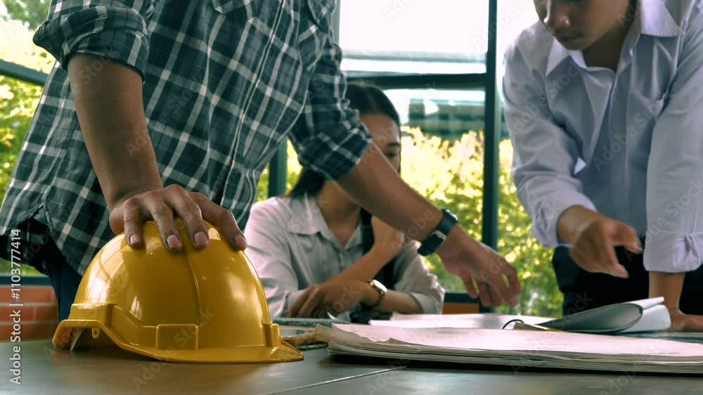 Contractor and engineer with blueprints discuss, choosing materials at ...