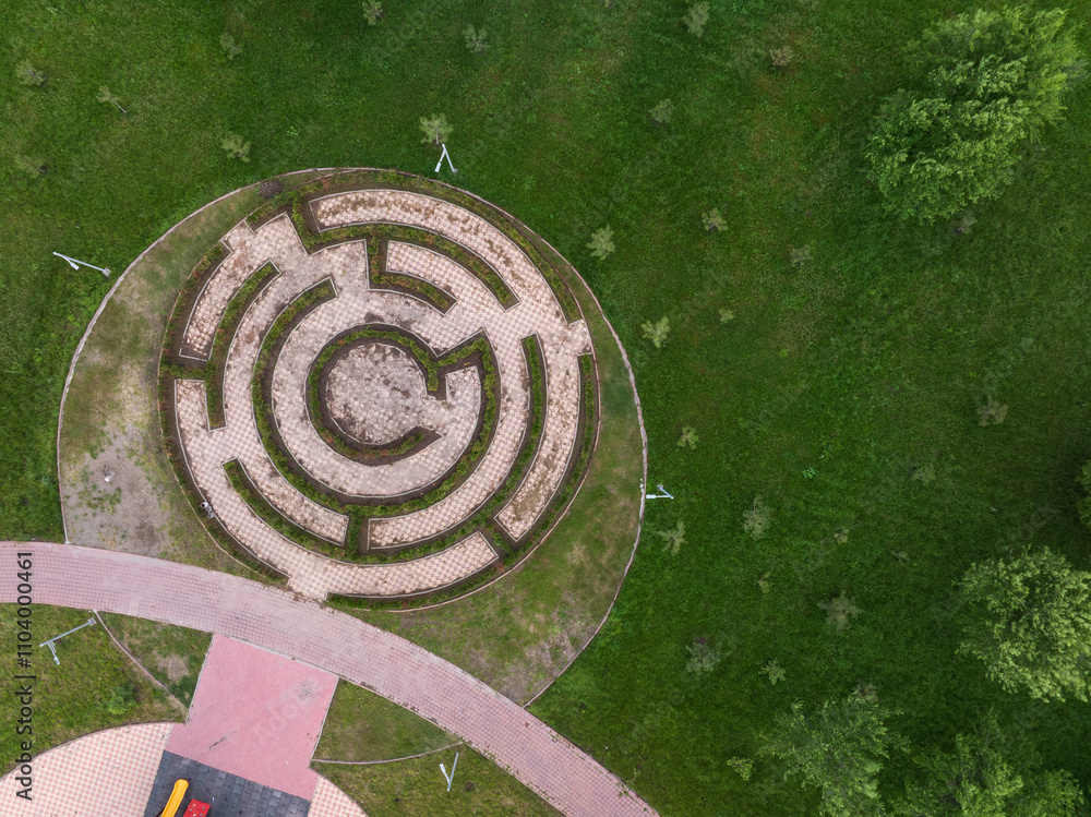 Labyrinth in a children's park, square. Yellow and pink paths for ...
