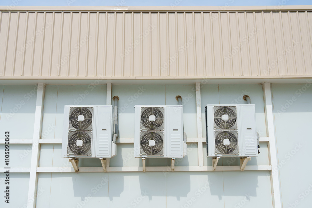 Air compressor or air condenser unit located on support outside ...