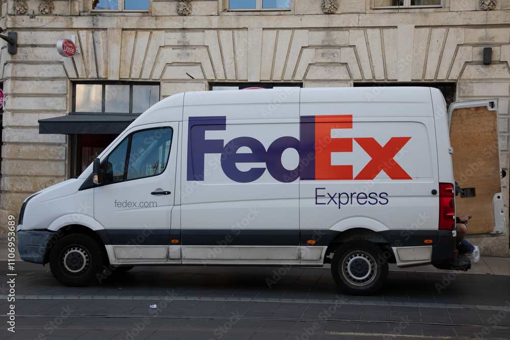 Fedex express logo brand and sign text on side panel delivery van truck ...