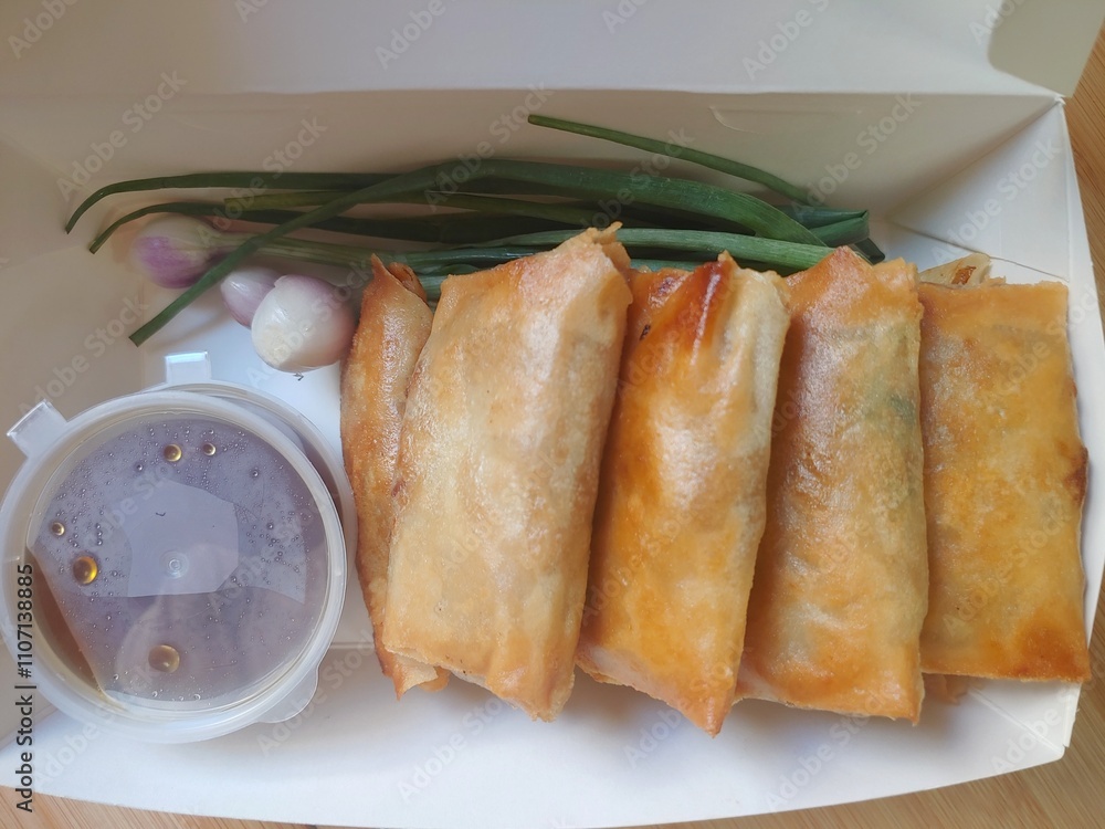 Lumpia or lunpia in paper box for take away, traditional snacks from ...