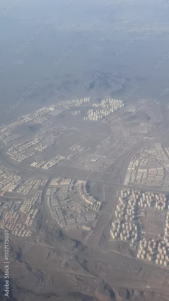 The new city of Parand in southwest Tehran and the industrial town next ...