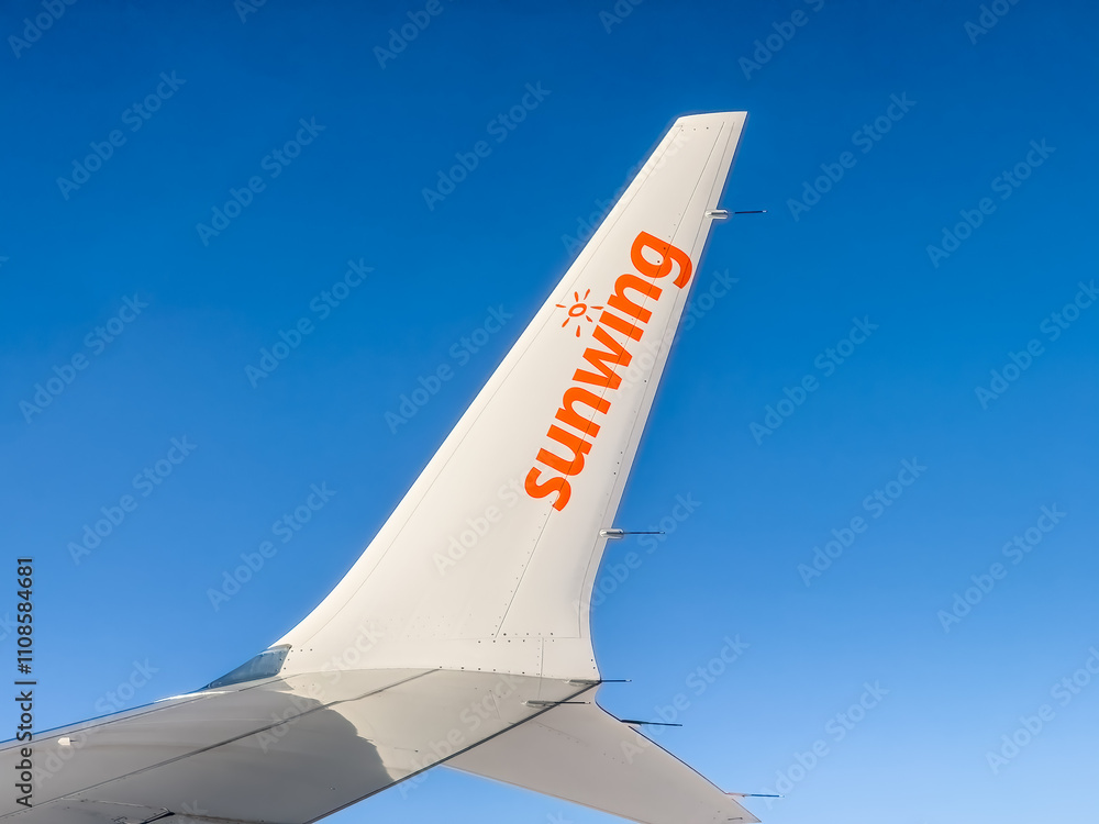 Calgary, Alberta, Canada. Nov 28, 2024. The distinctive orange Sunwing ...