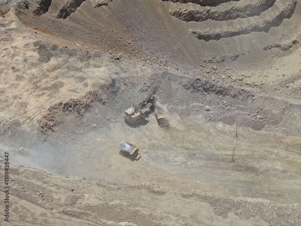 Electric Mining Shovel in Full Operation Loading Trucks at an Open-Pit ...
