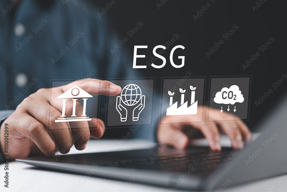 ESG environmental, social and governance. Man using laptop with ESG icons on virtual screen for ...
