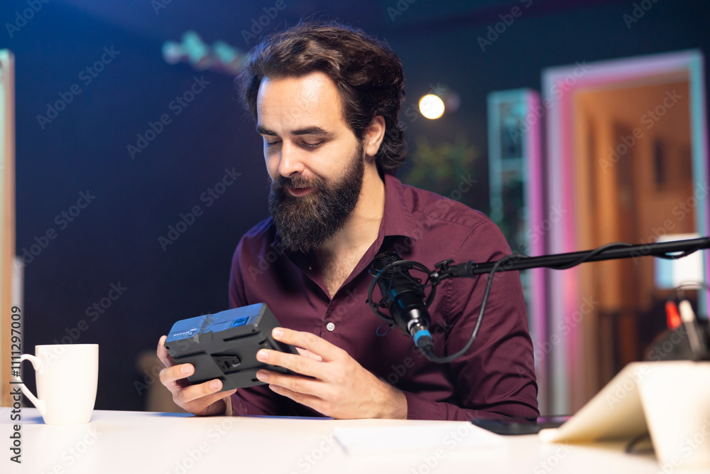 Tech content creator filming technology review of newly released V ...